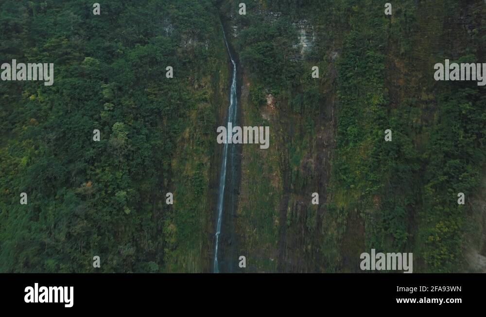 Two stunning waterfalls cascading over dramatic vertical cliff faces of ...