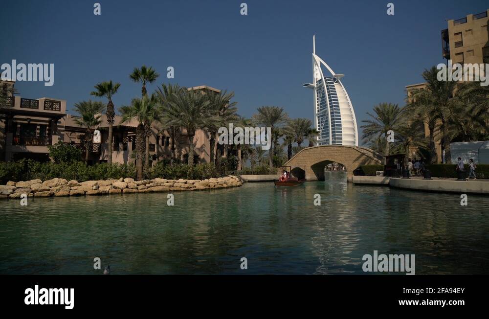 The Madinat Jumeirah resort's lake and Burj Al Arab Stock Video Footage ...
