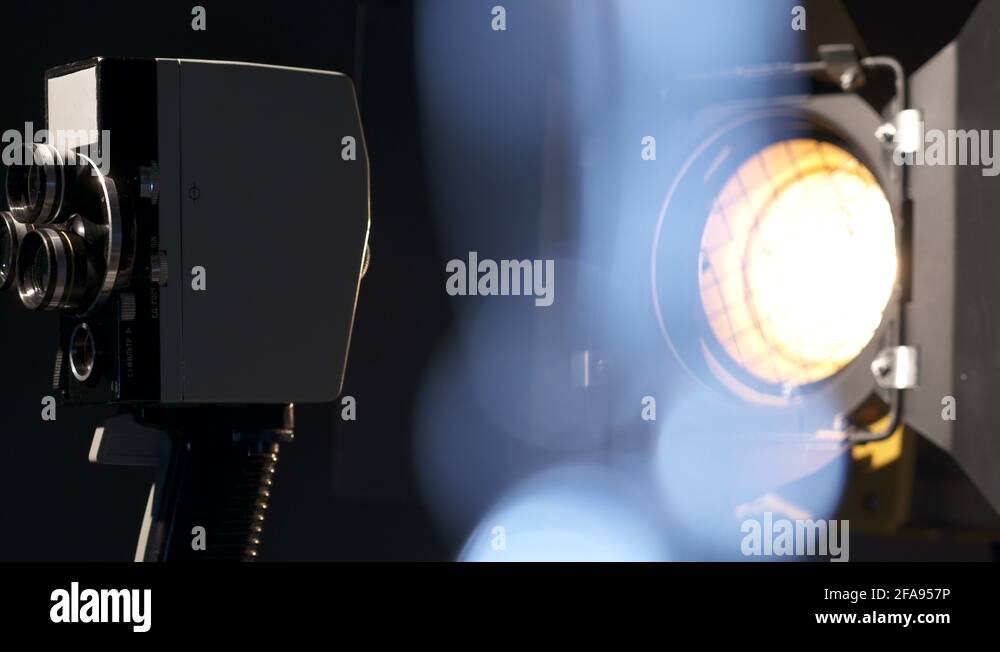 Vintage 8mm film movie camera rotating on black background Stock Video ...