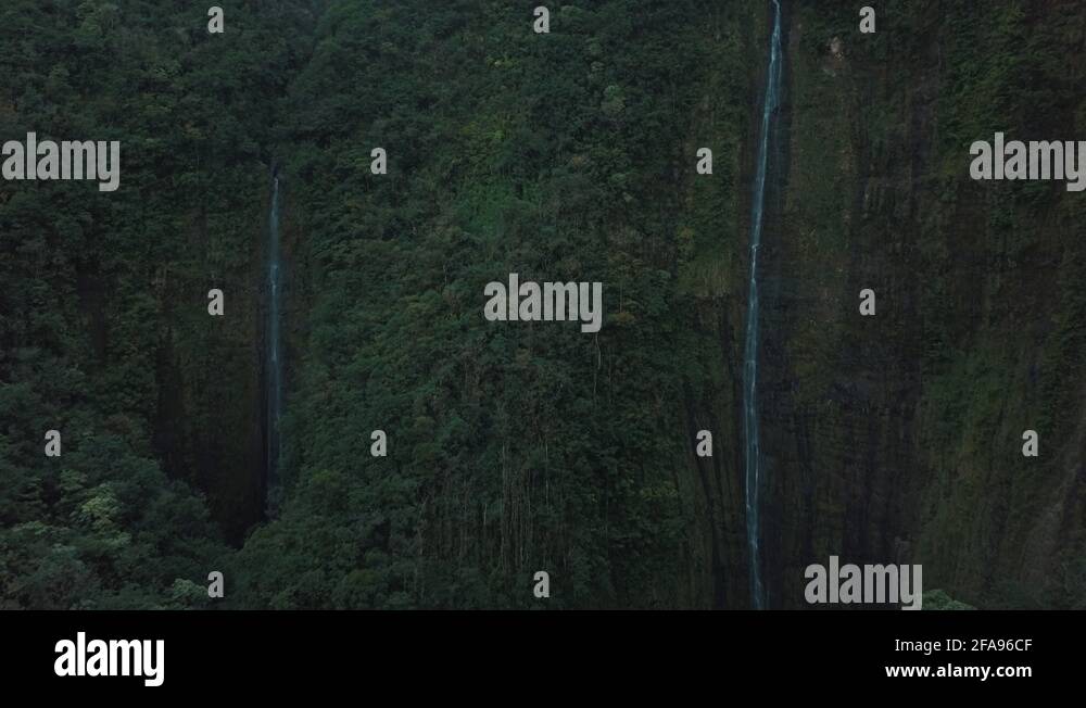 Two stunning waterfalls cascading over dramatic vertical cliff faces of ...