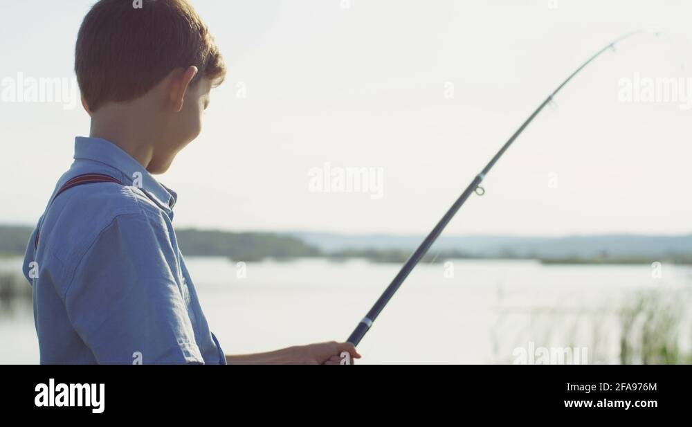 Boy catching a fish Stock Videos & Footage - HD and 4K Video Clips - Alamy