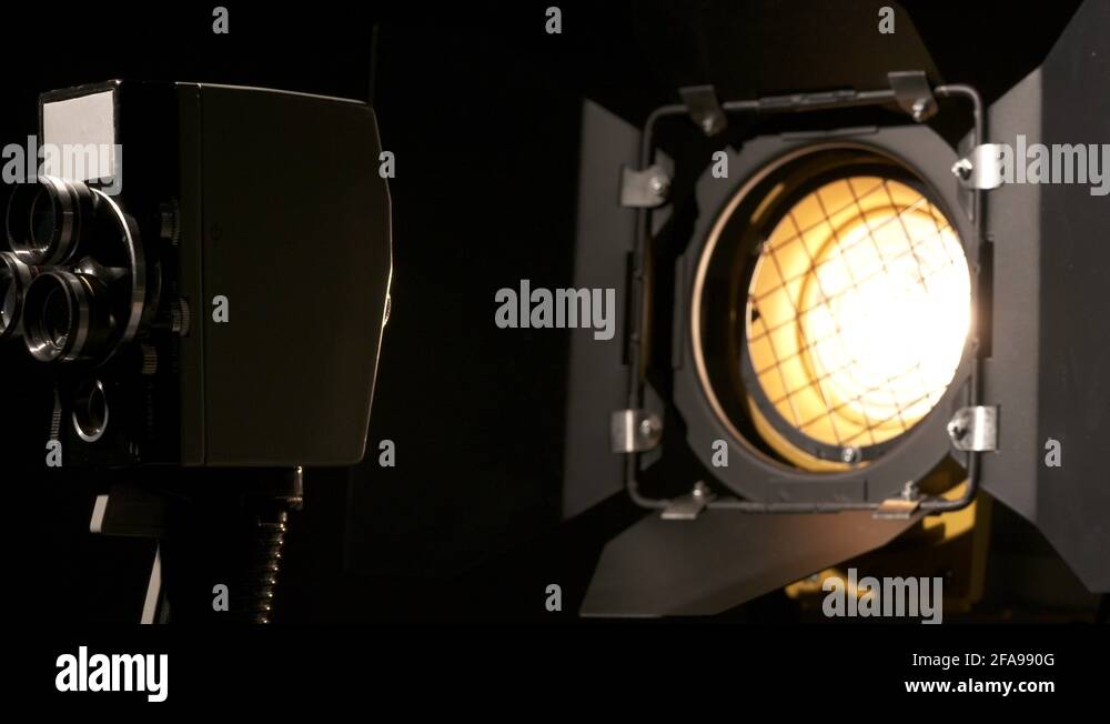 Vintage 8mm film movie camera rotating on black background Stock Video ...