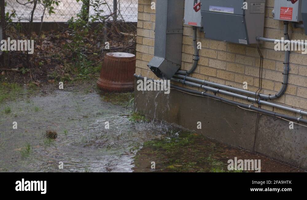 Water pouring from rain gutter (1080 Stock Video Footage - Alamy