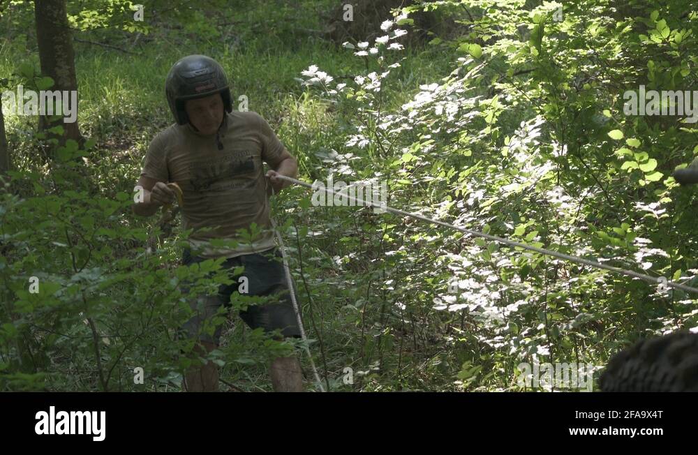 Man pulling car rope Stock Videos & Footage - HD and 4K Video Clips - Alamy