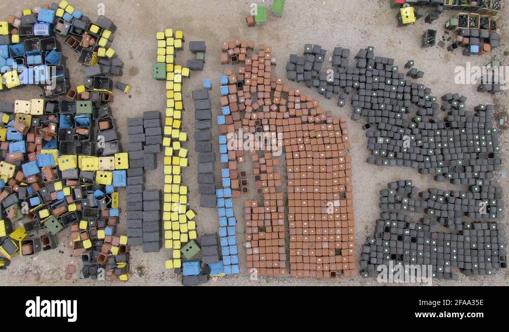 TOP DOWN: View from above of empty colorful garbage cans in a large ...