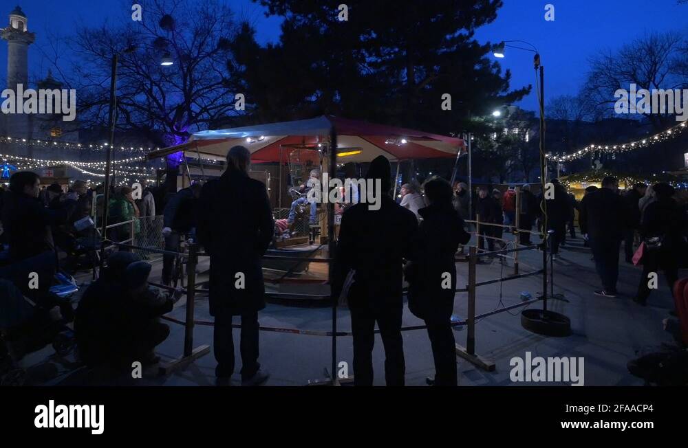 Bicycle-powered carousel at a Christmas market Stock Video Footage - Alamy