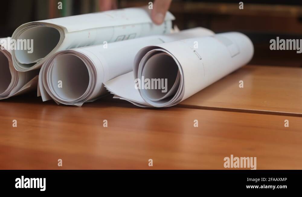 Rolled architectural blueprints construction plans Stock Videos ...