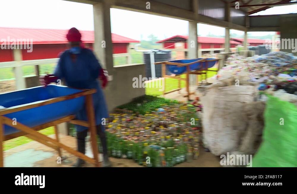Women washing plastic waste in a recycling unit in Kigali, Rwanda ...