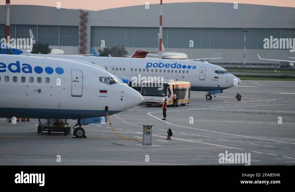 The Work Of Ground Services Of The Airport The Marshal Gives The Crew Commands Stock Video