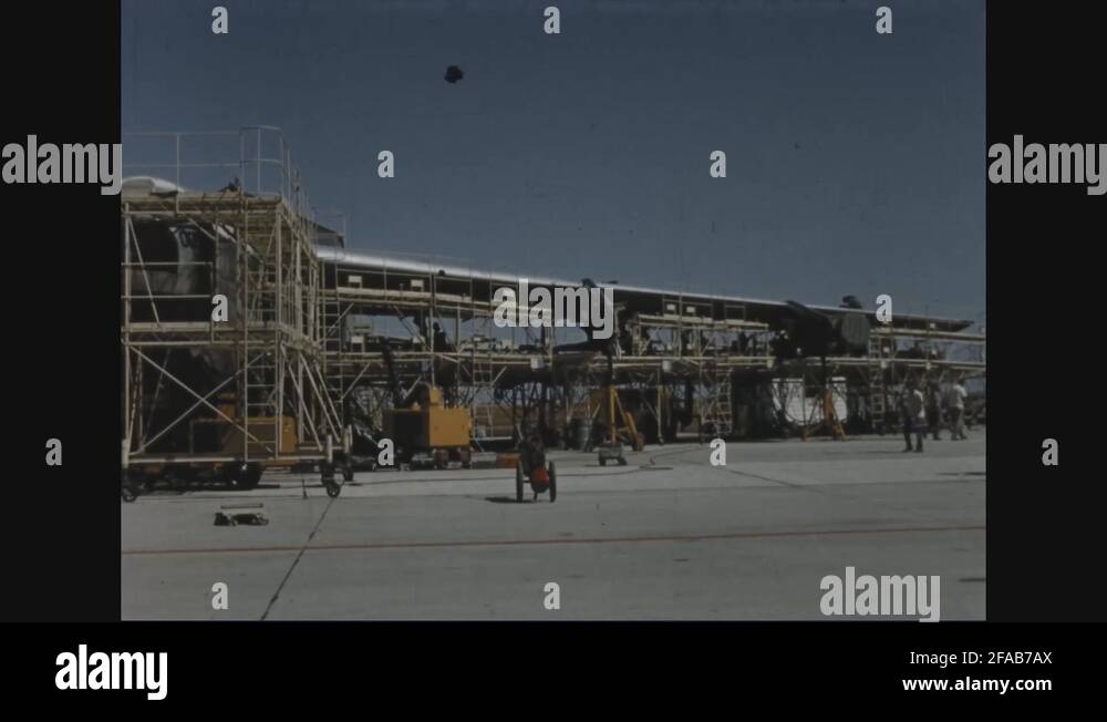 Men work on modification of wing structure of Boeing B-52 ...