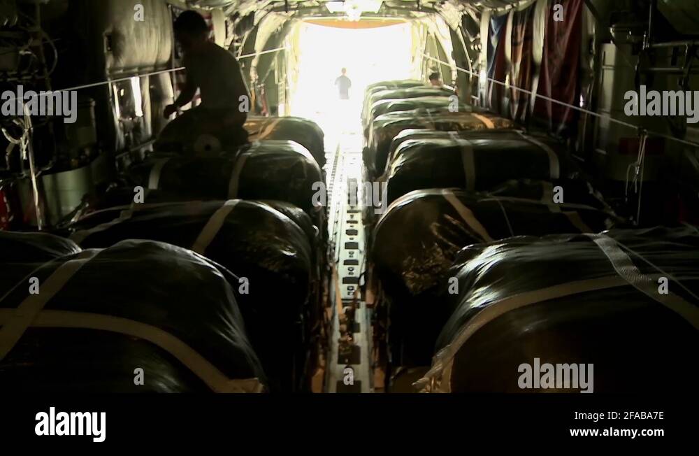 Airmen load cargo into US Air Force C-130J Super Hercules - 2014 Stock ...
