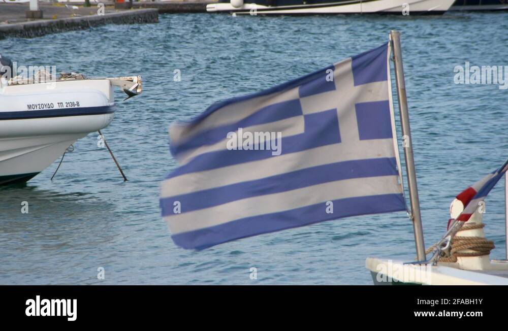 Pan of A Greek Flag On a Yacht Flies in a Strong Wind While Sea Birds ...