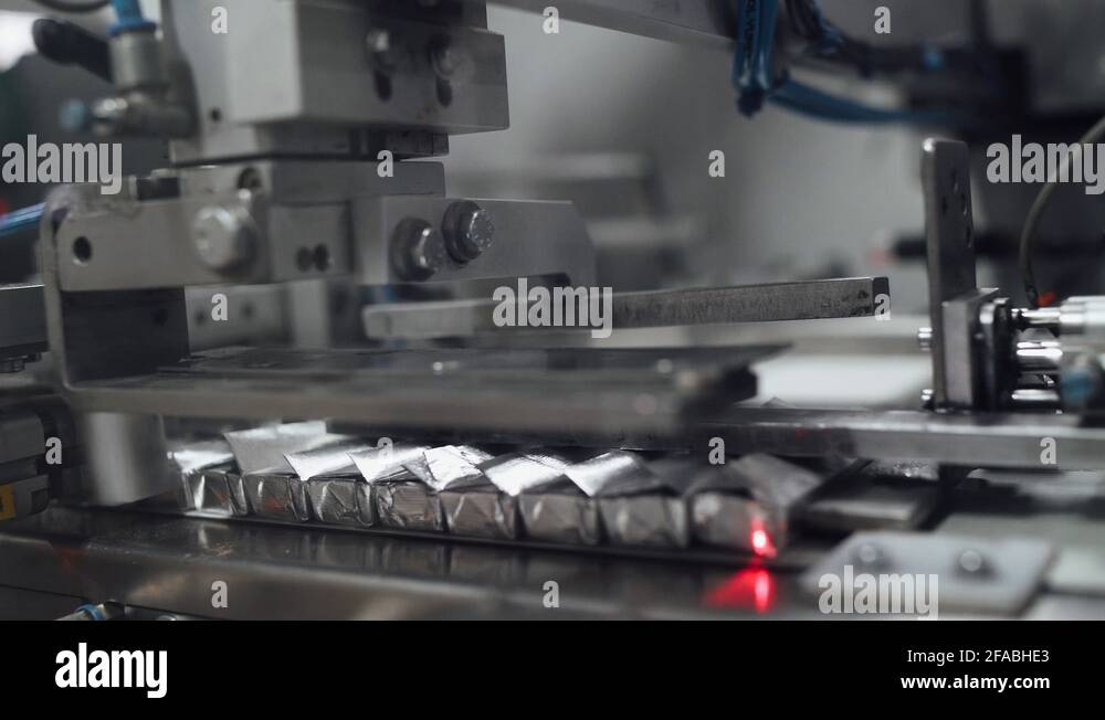 Chocolate factory, chocolate candies packaging process, view of factory ...