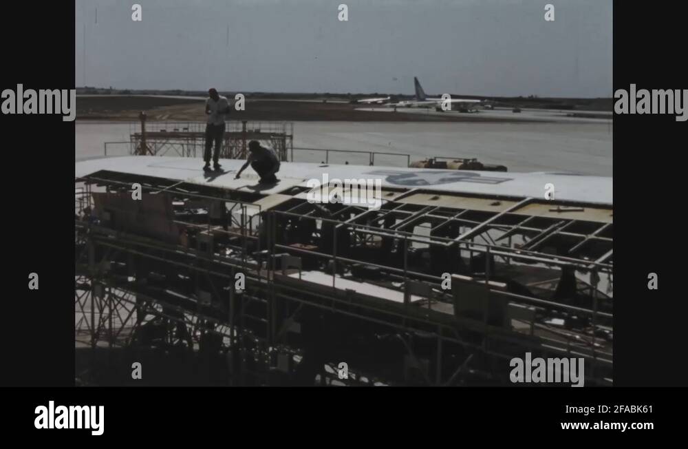 Workers work on modification of wing structure of B-52 Stratofortress ...