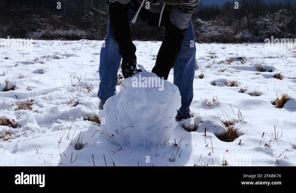 Rolling the snowball Stock Videos & Footage - HD and 4K Video Clips - Alamy