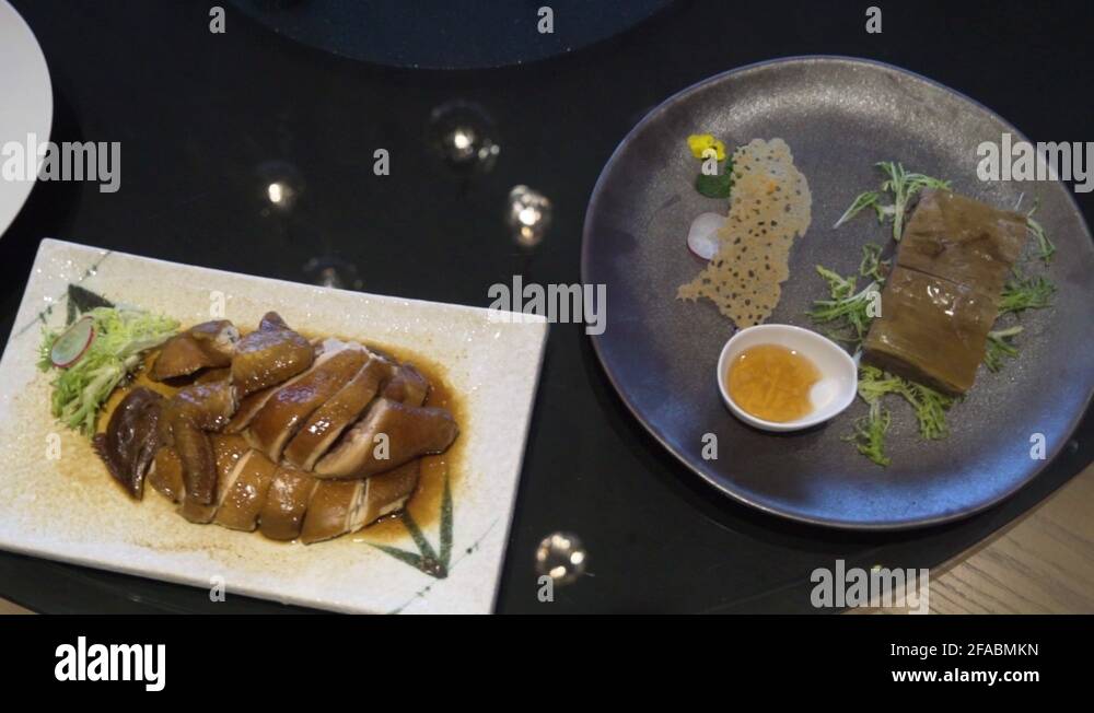 Rotating dinner table at Chinese restaurant, multiple dishes to choose ...