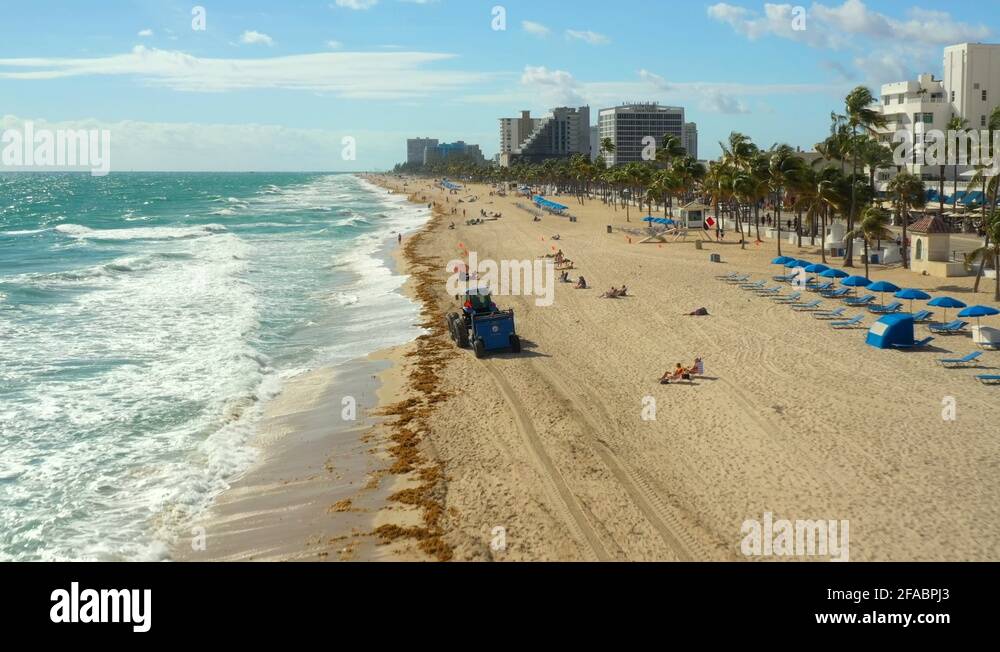 Beach comber cleaning the sand Fort Lauderdale aerials Stock Video ...