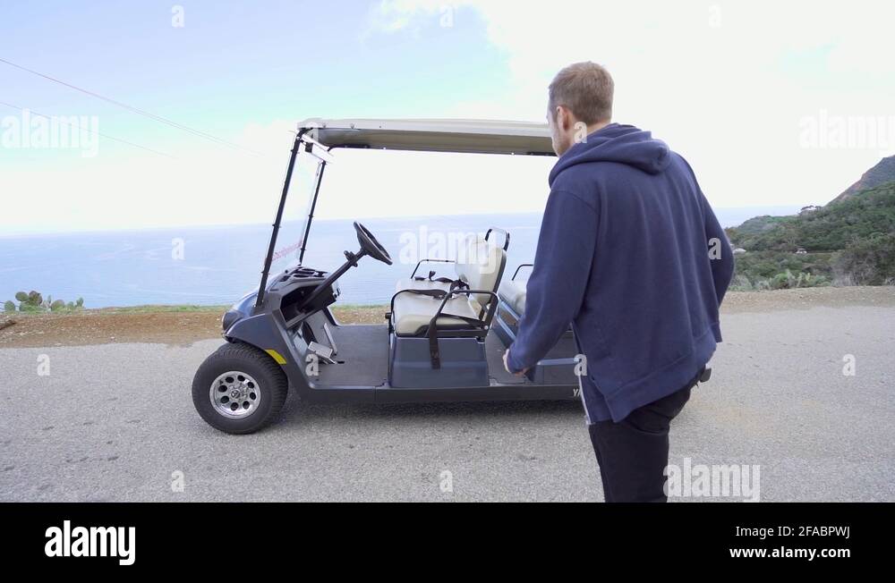 Gold cart driver Stock Videos & Footage - HD and 4K Video Clips - Alamy