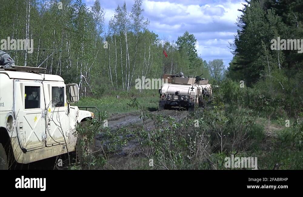 Humvee vehicle drive through forest road at Ethan Allen Air Force Base ...