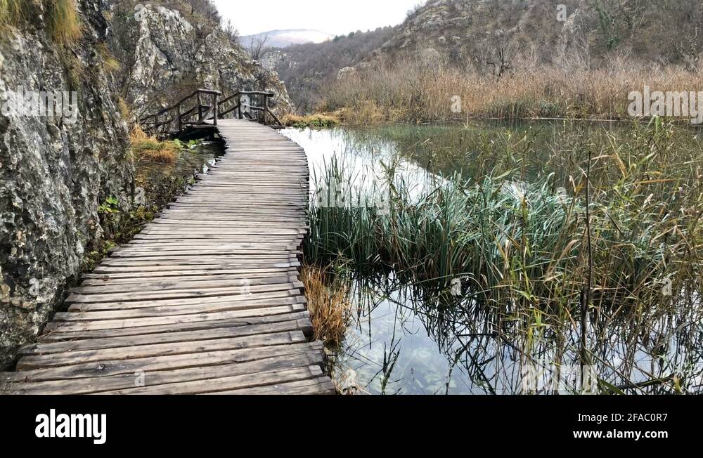 Wooden bridge over the water in nature park Plitvicka jezera in Croatia ...