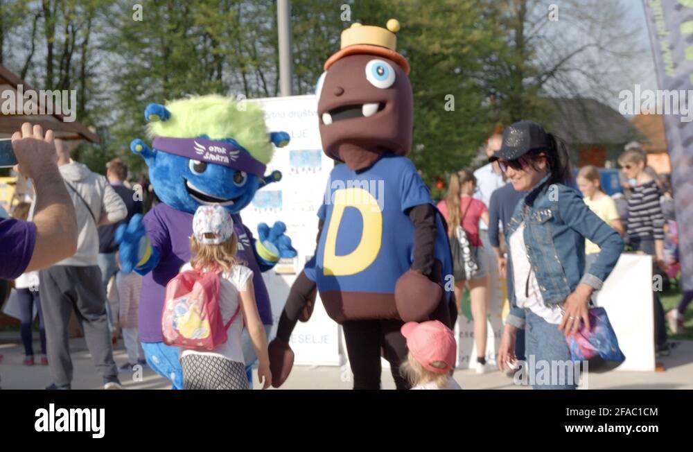Kids are happy to see and hug mascots Stock Video Footage - Alamy
