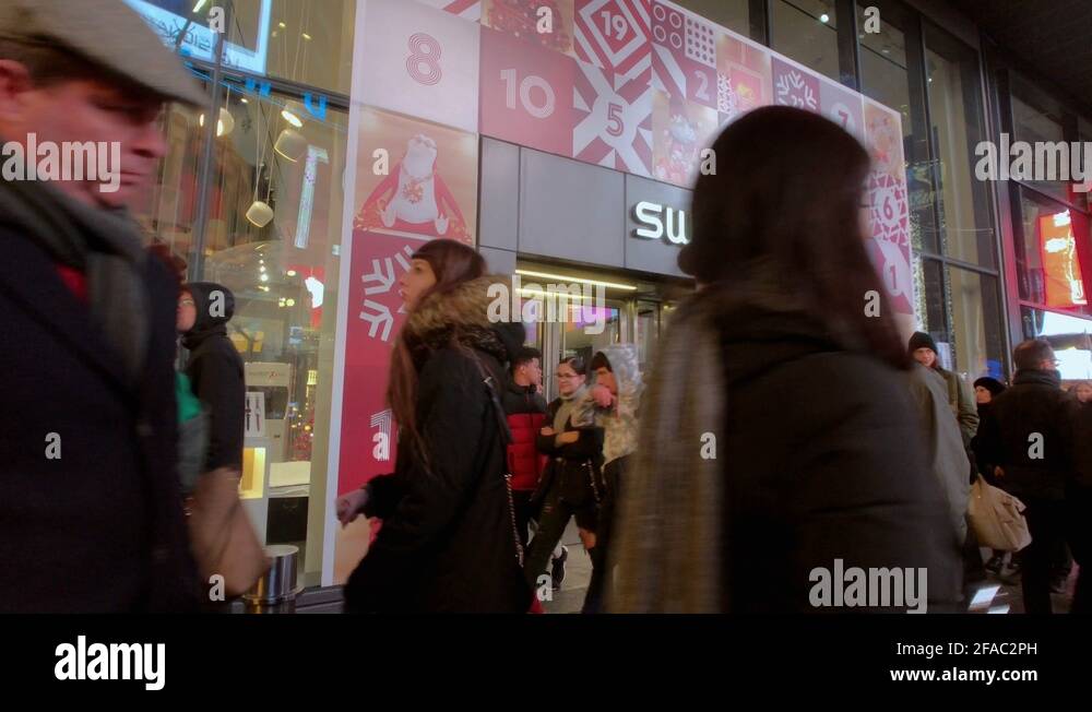 Tourists Walking by the Swatch Watch Store in Times Square (NYC Stock ...