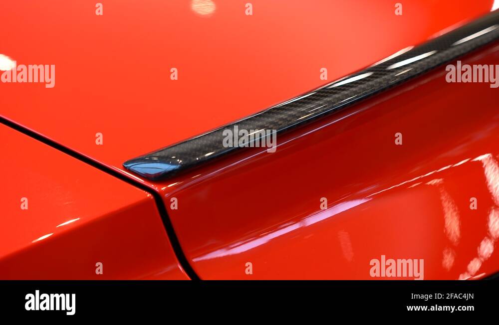Red sports car motorized slider shot of the trunk with carbon fibre ...
