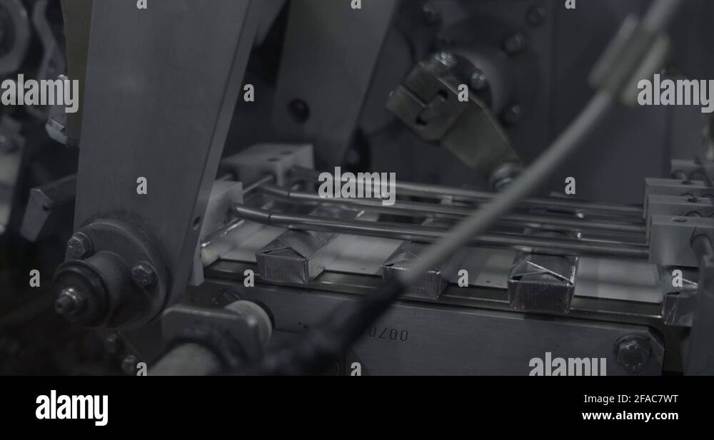 Chocolate factory, chocolate candies packaging process, view of factory ...