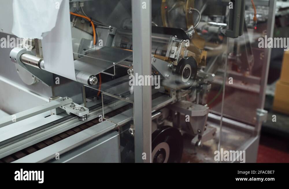 Chocolate factory, chocolate candies packaging process, view of factory ...