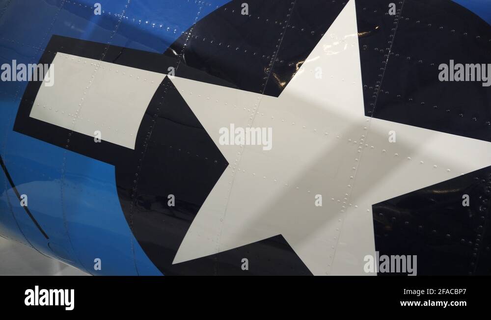 Slow pan to big white star on American Hellcat WWII fighter plane Stock ...