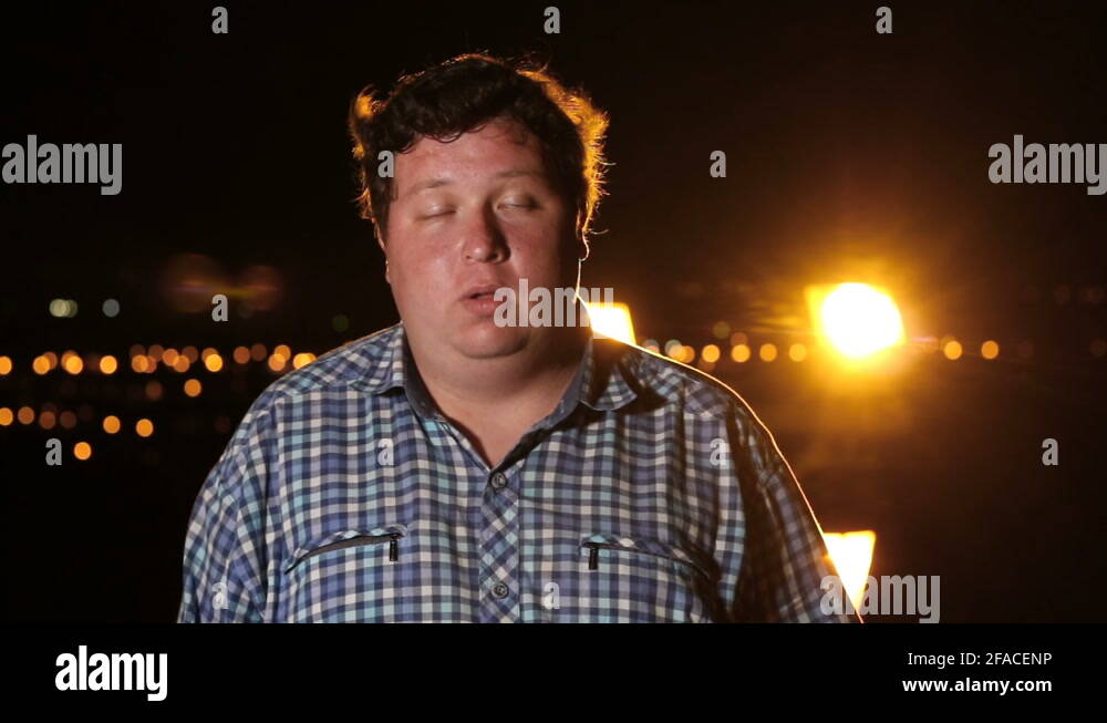 Man standing and falling asleep at night outdoor, portrait Stock Video ...