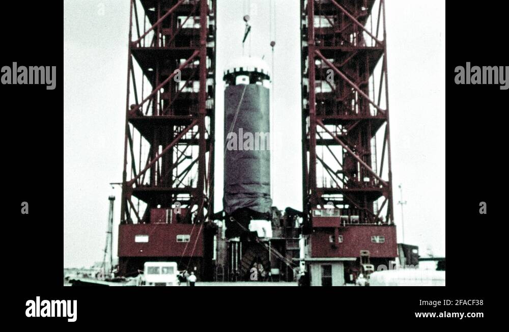 1960s: A rocket booster is in the middle of the Service Tower. The ...