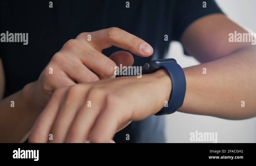 Smartwatch on male hand on isolated white background. Man using ...