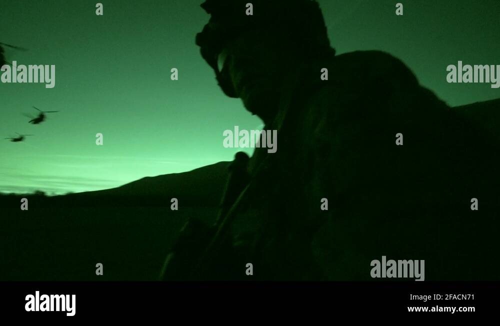 Night vision imagery of CH-47 Chinooks flying overhead soldier Stock ...