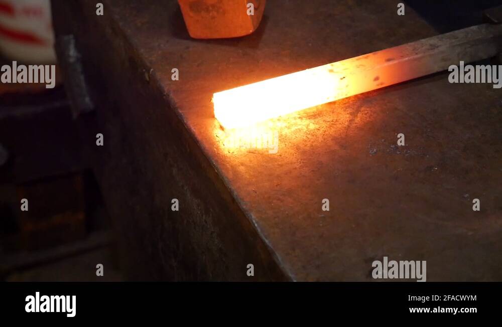 Blacksmithing in Slow Motion to Forge a Taper on a Hot Metal Bar in the ...