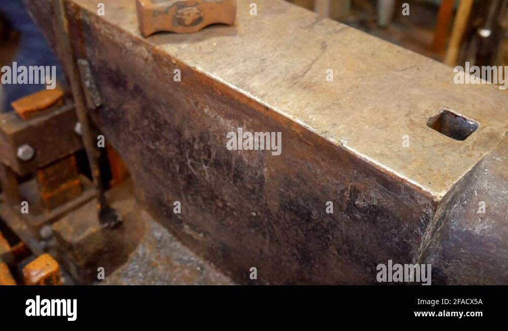 Shaping a Forged Rat's Tail in Metal Bar at the Anvil in the Blacksmith ...