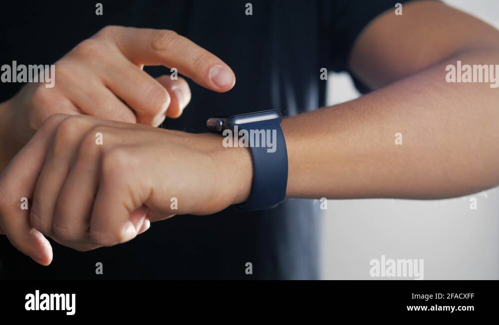 Smartwatch on male hand on isolated white background. Man using ...