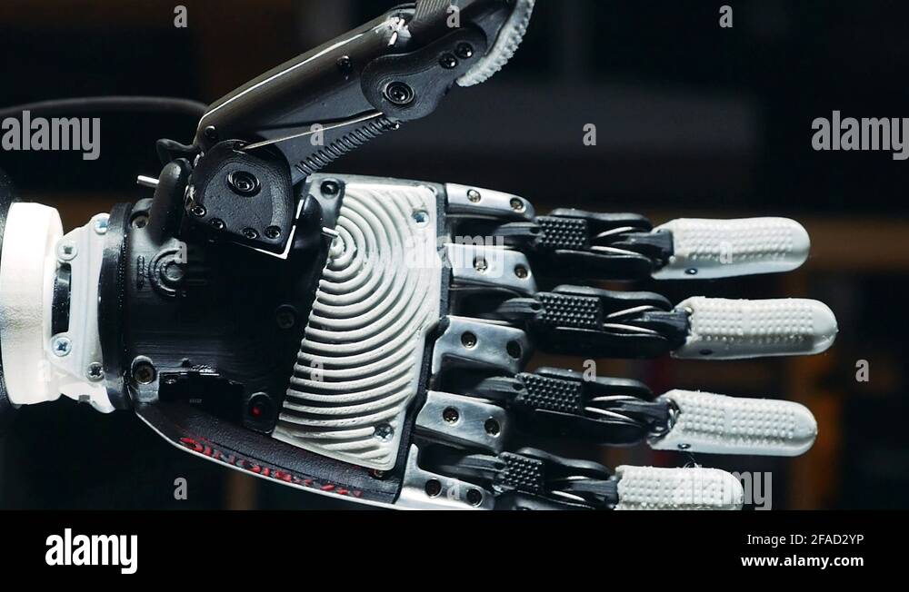 Fist of a robotic arm is clenching while it's getting lowered Stock ...