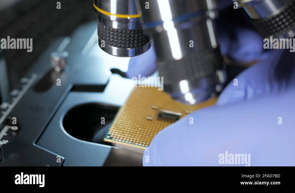 Processor is being examined for apparent defects under microscope. In ...
