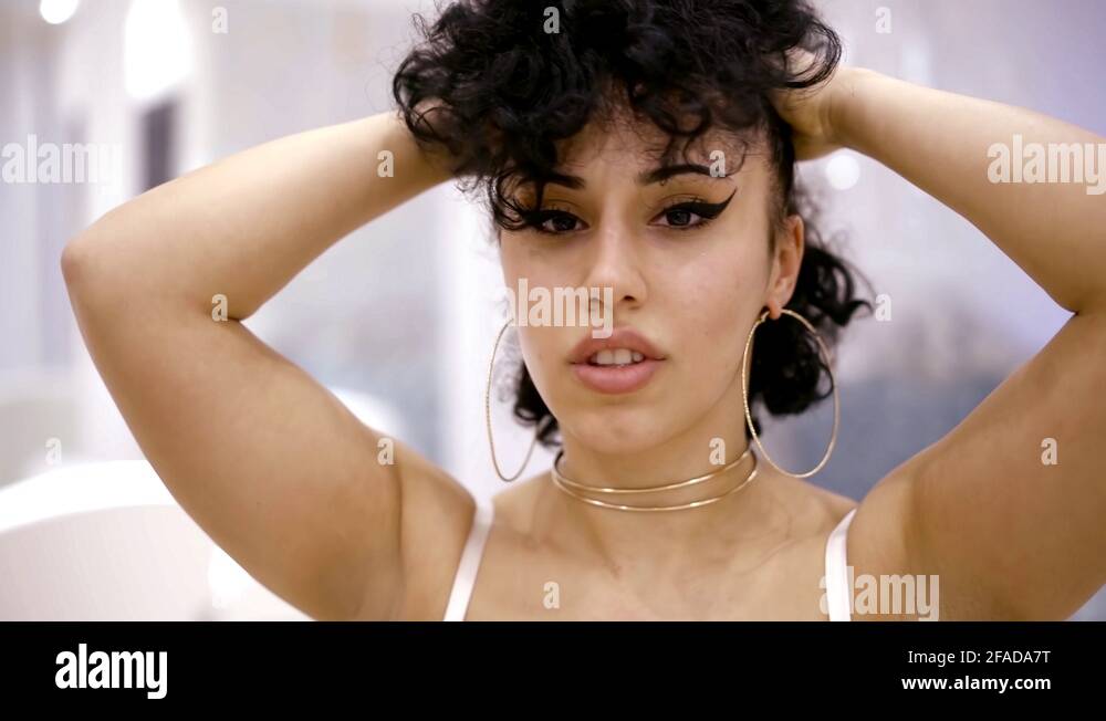 portrait of a pretty Eastern woman. Correct to shape the hair in front ...