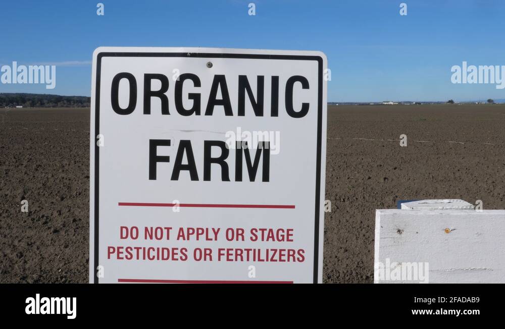 Organic farm sign warning against use of pesticides and fertilizers ...