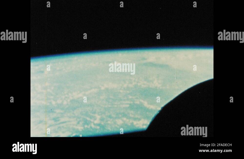 1960s: Gemini command module floats in Earth's orbit. American flag on ...