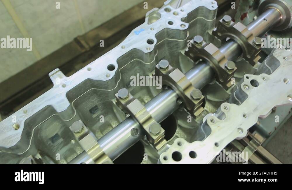 Mechanic controls the repair process of car engine cylinder head Stock ...