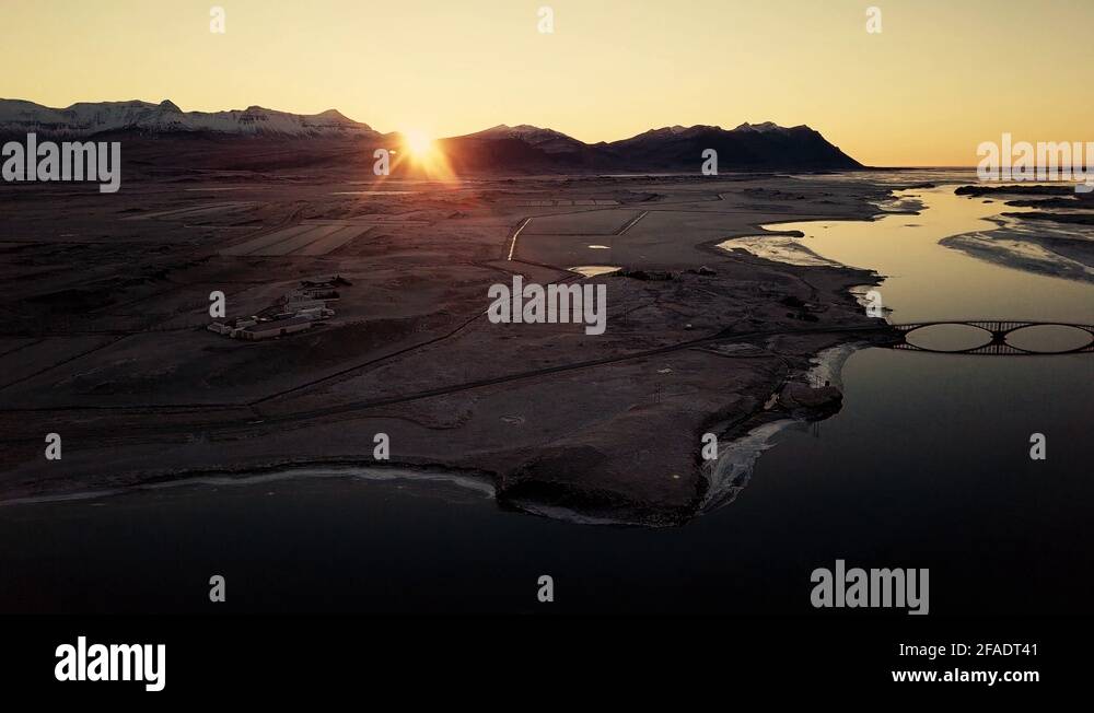 Drone flying sideways, showing beautiful scenic bridge casting a Stock ...