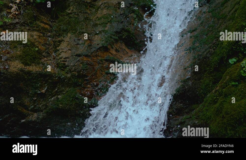 CLOSE UP: Spectacular shot of river flowing into a pool and forming a ...