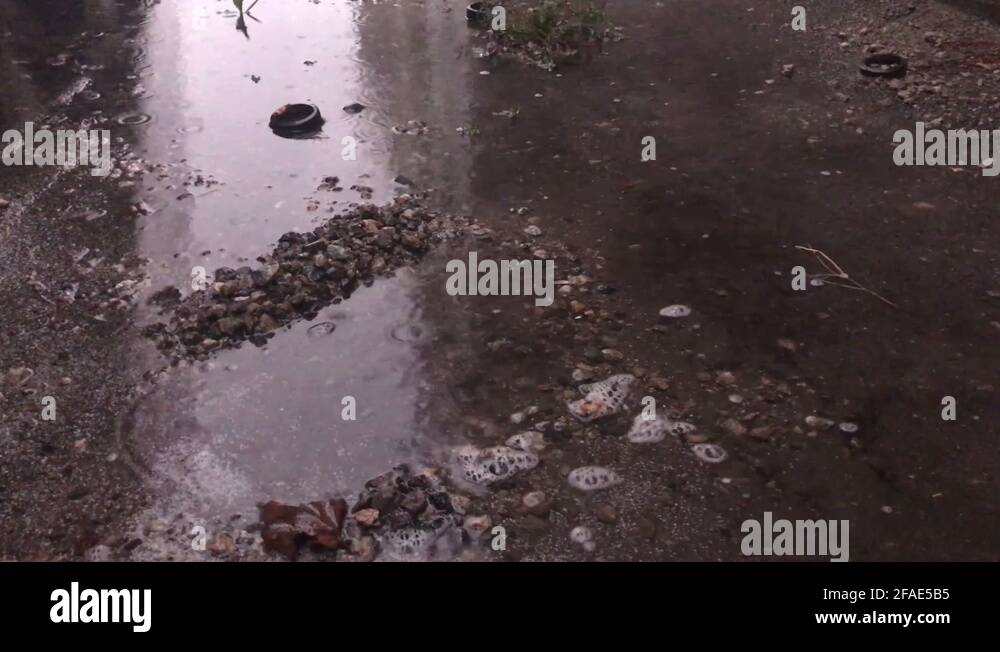 Rain drops falling puddle in Stock Videos & Footage - HD and 4K Video ...