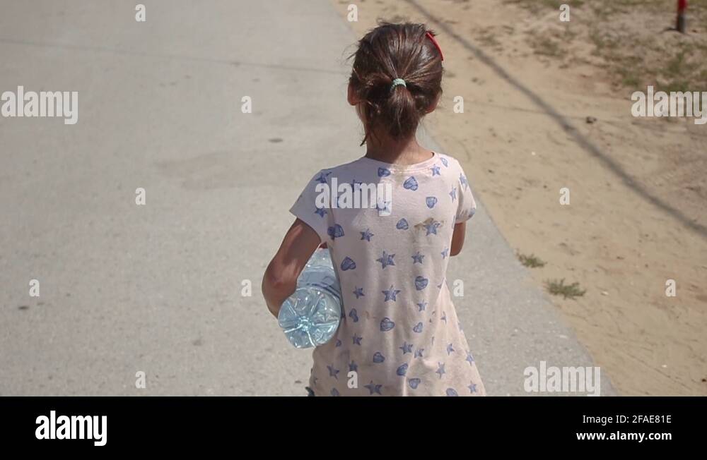 Poor gypsy girl take home water Stock Video Footage - Alamy