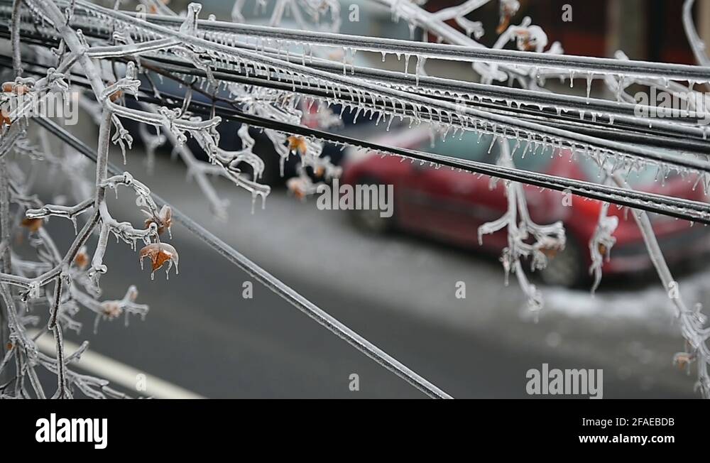 Electricity cables covered in ice after frozen rain phenomenon Stock ...