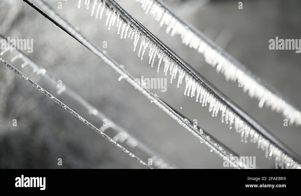 Electricity cables covered in ice after frozen rain phenomenon Stock ...