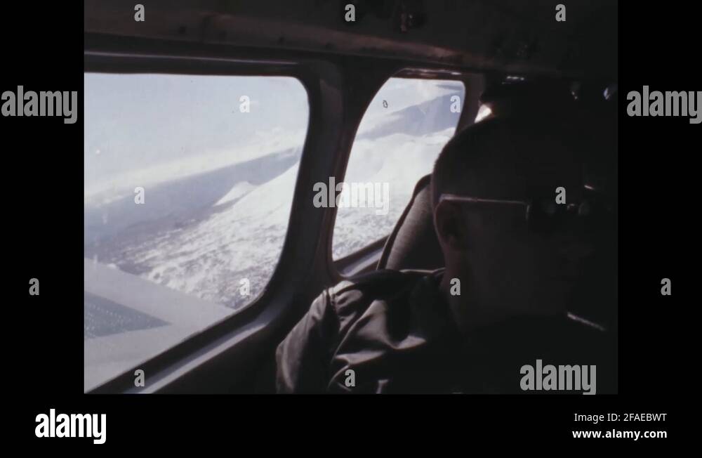 Astronauts look at charts and astronauts leave aircraft at field - 1965 ...